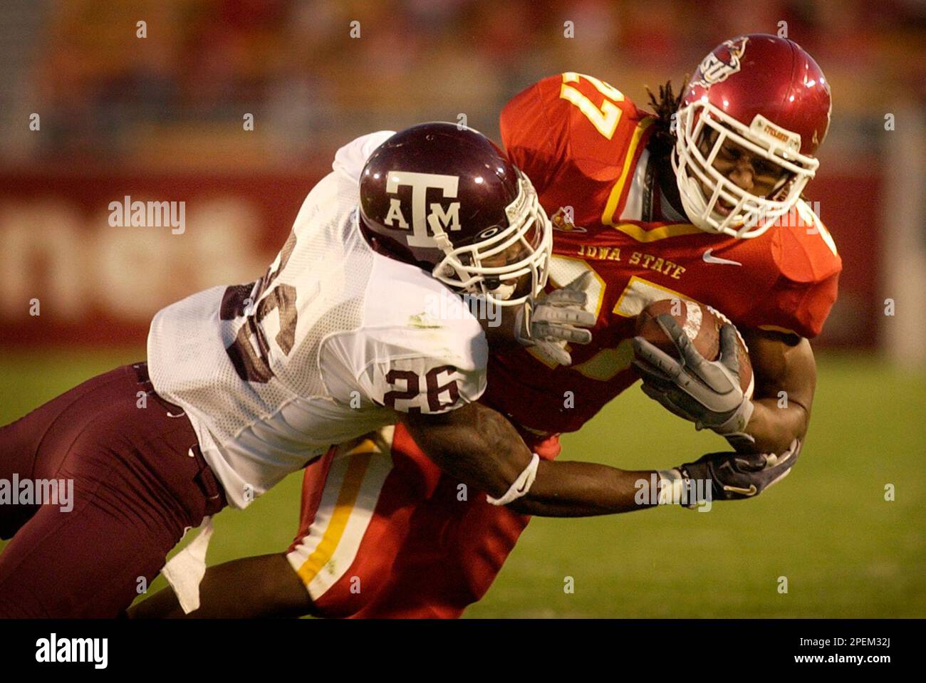 Iowa State's Stevie Hicks, right, is tackled by Texas A&M's Jonte Buhl ...