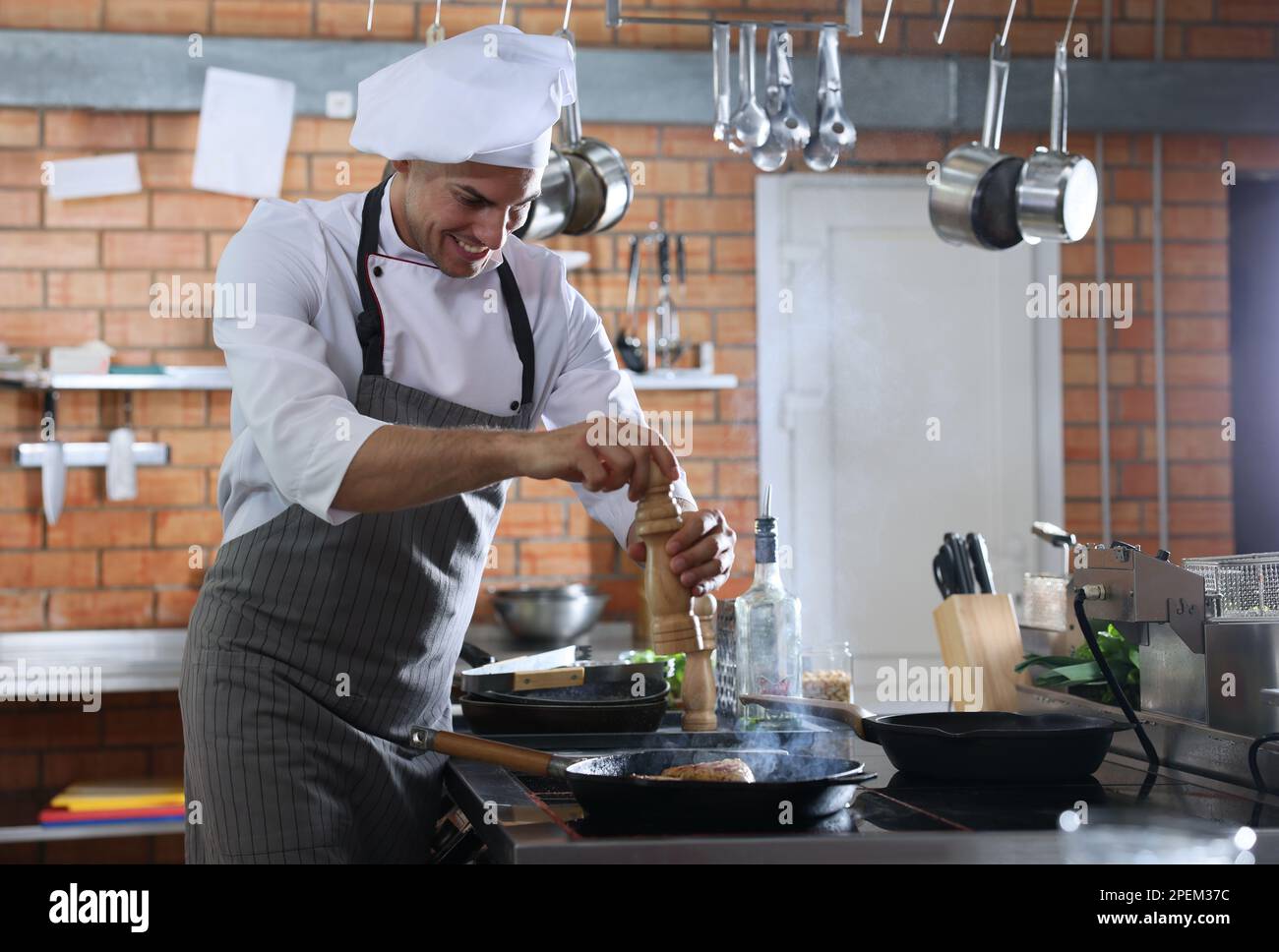 Cooking meat on stove hi-res stock photography and images - Alamy