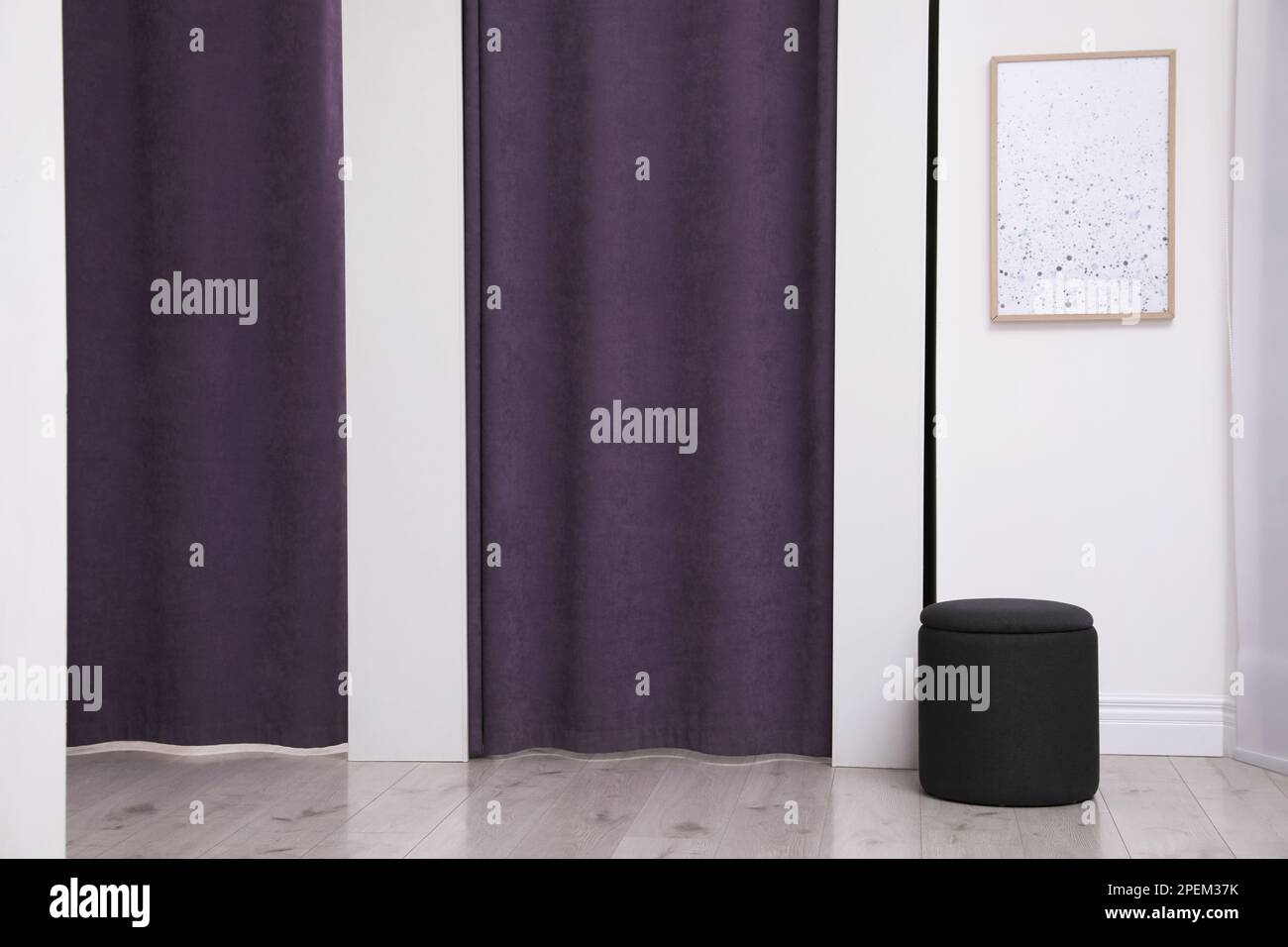 Dressing rooms with stylish purple curtains in fashion store Stock ...