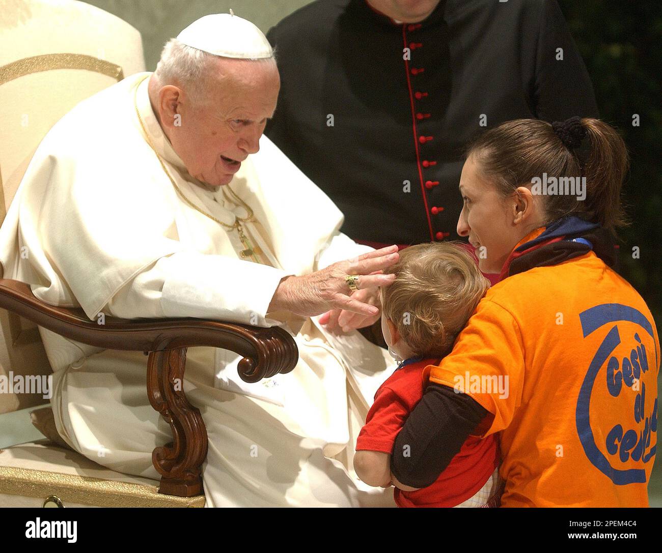 Pope John Paul II blesses a child during a meeting with Rome's Catholic ...