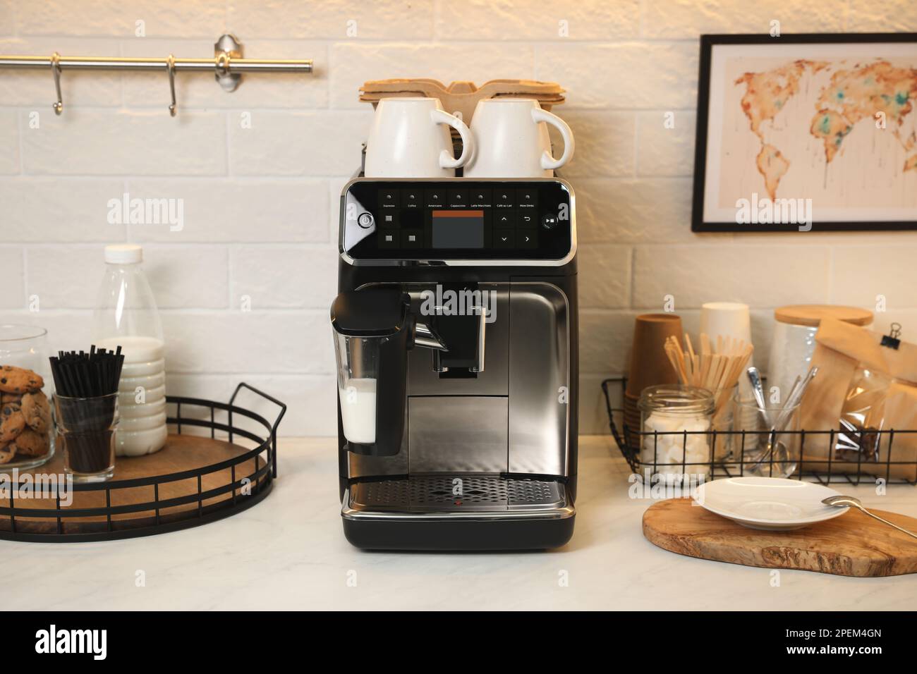 Modern coffee machine on countertop in office kitchen Stock Photo - Alamy