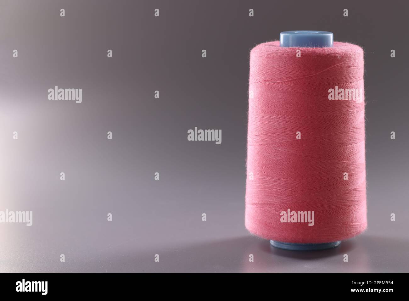 Threads of light pink color in coil Stock Photo - Alamy