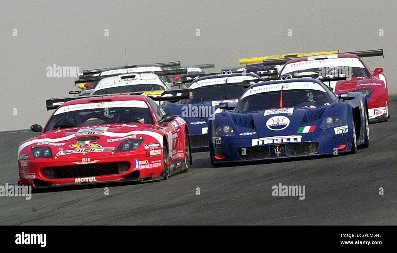 Matteo Bobbi from Italy powers his Ferrari 550 Maranello, left, and ...