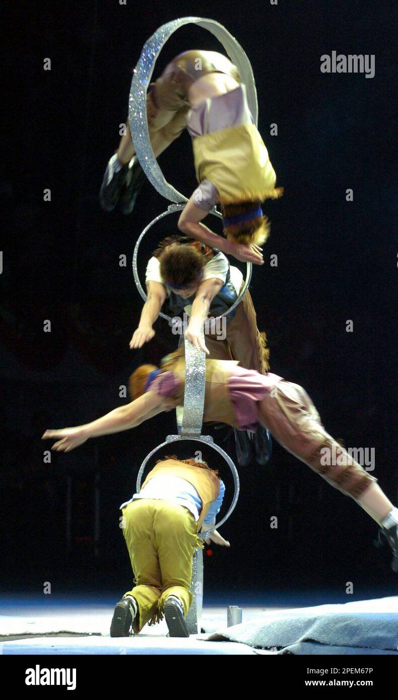 Acrobats jump through rings at the Sixth Gold Lion National Acrobatics ...