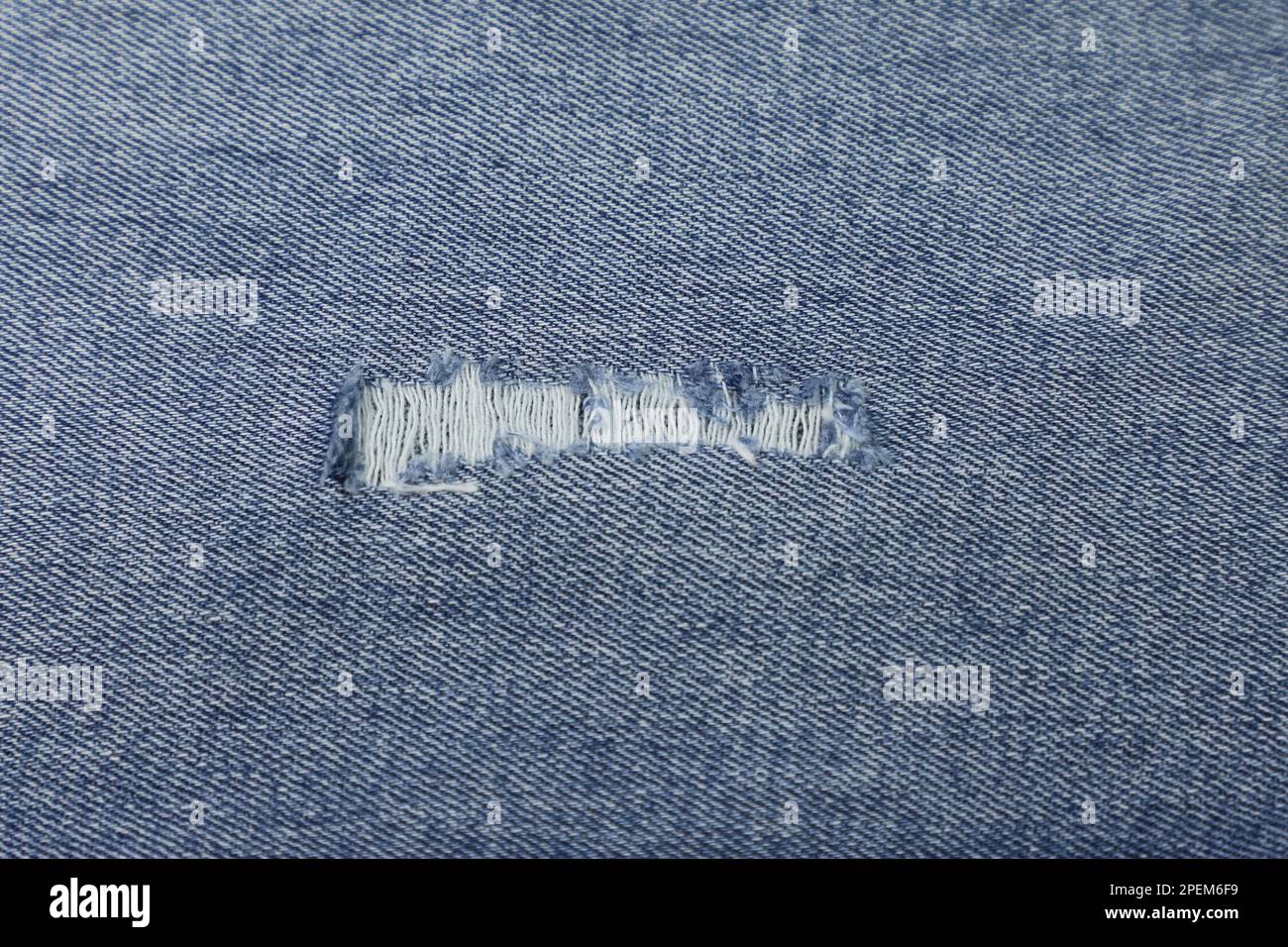 Torn fabric hi-res stock photography and images - Alamy