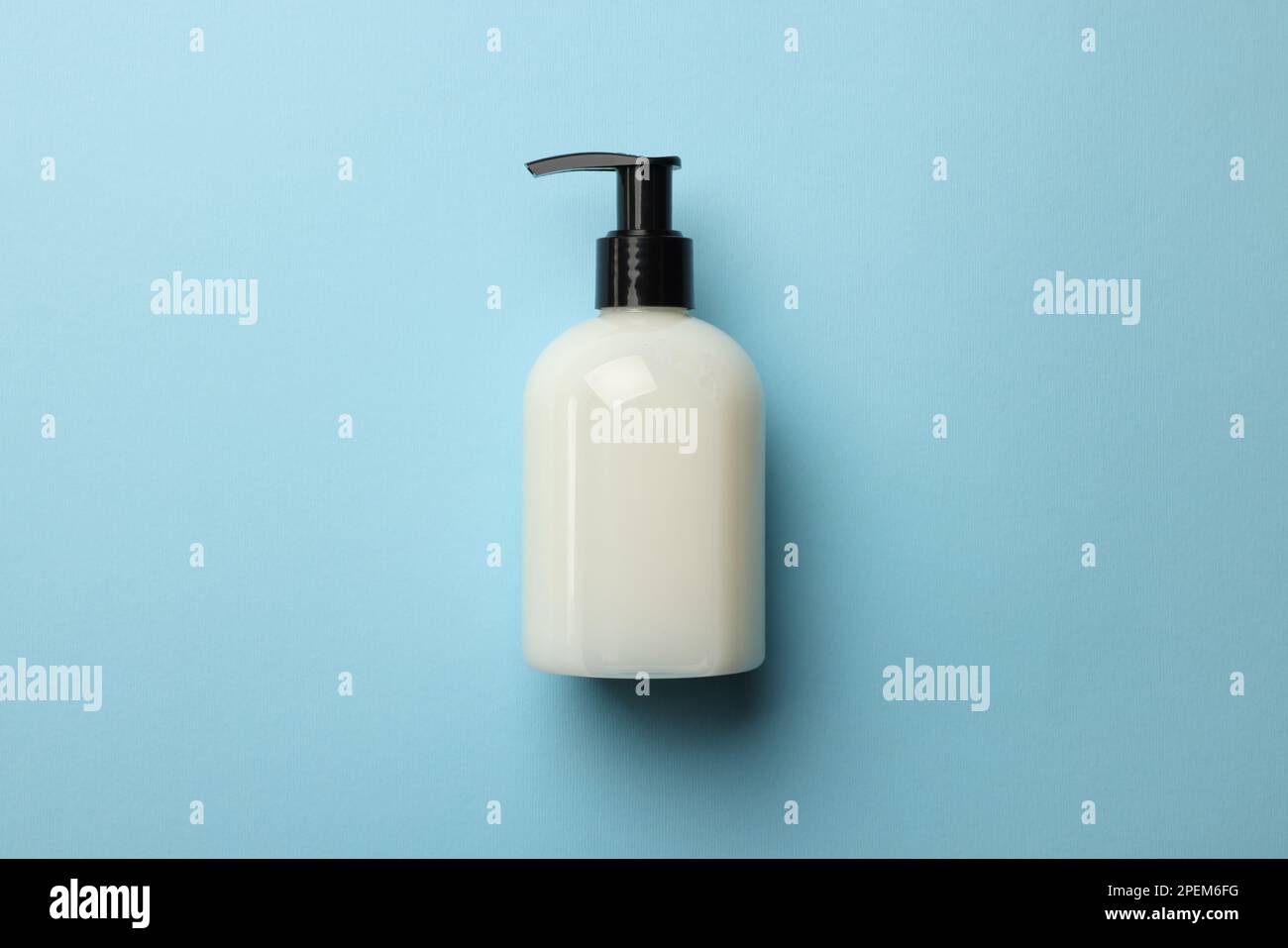 Bottle of liquid soap on light blue background, top view Stock Photo ...