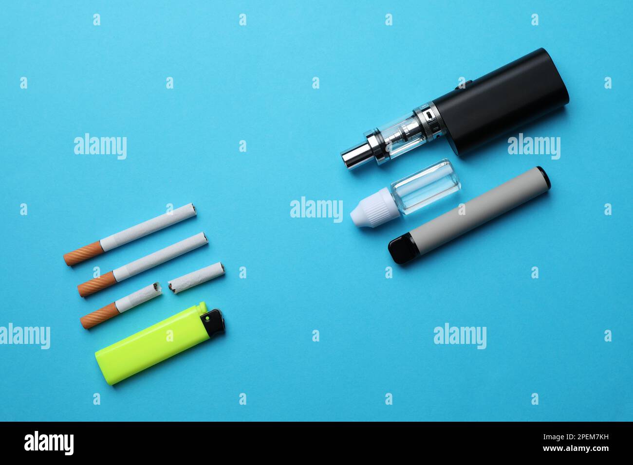 Lighter, liquid solution, electronic and regular cigarettes on light ...