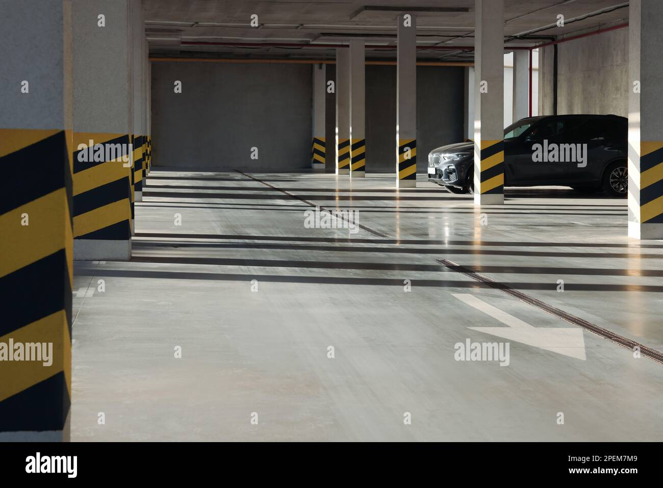 Open parking garage with car on sunny day Stock Photo - Alamy