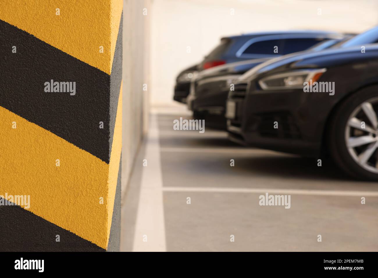 Outdoor parking lot, focus on column with warning stripes Stock Photo ...