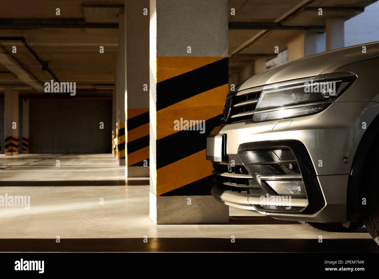Open parking garage with car on sunny day Stock Photo - Alamy
