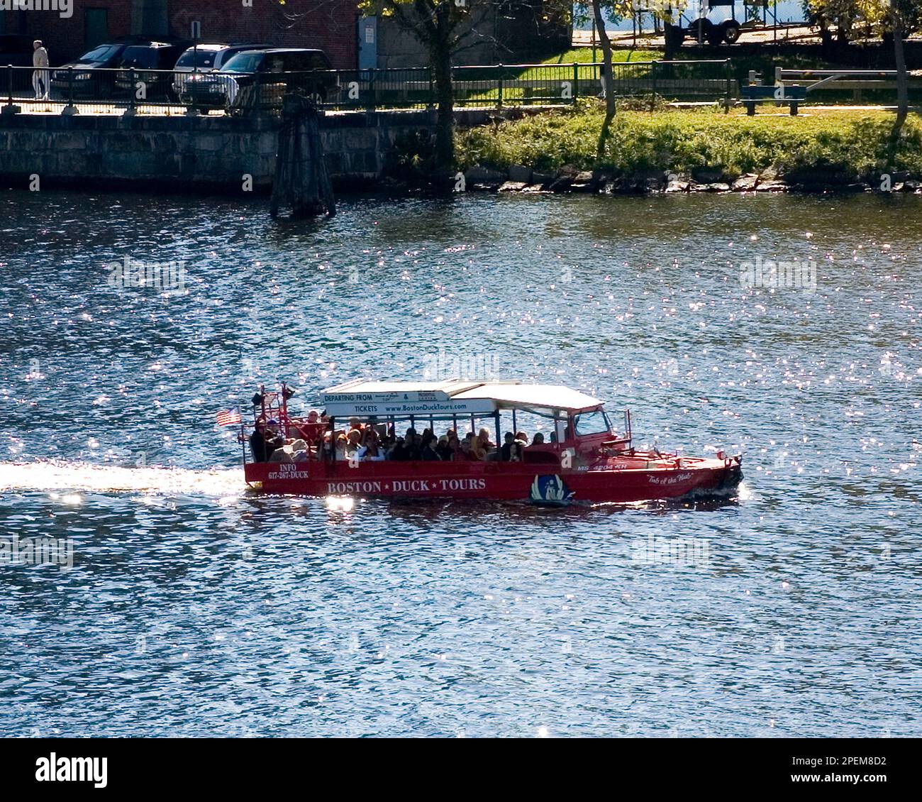 A Duck Tour amphibious vehicle makes its way through the Charles River ...