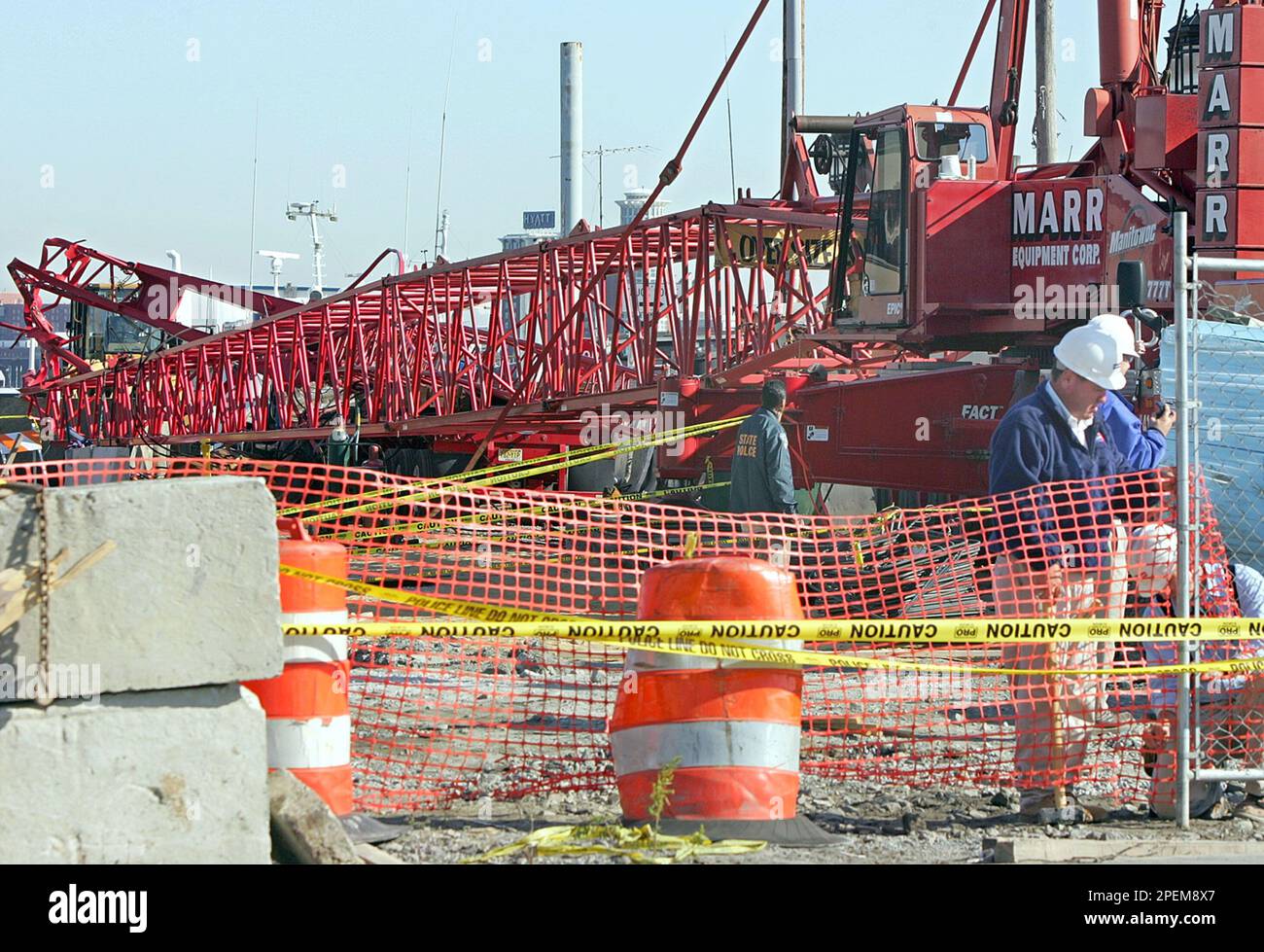 Construction workers and a Massachusetts State Police officer are seen ...