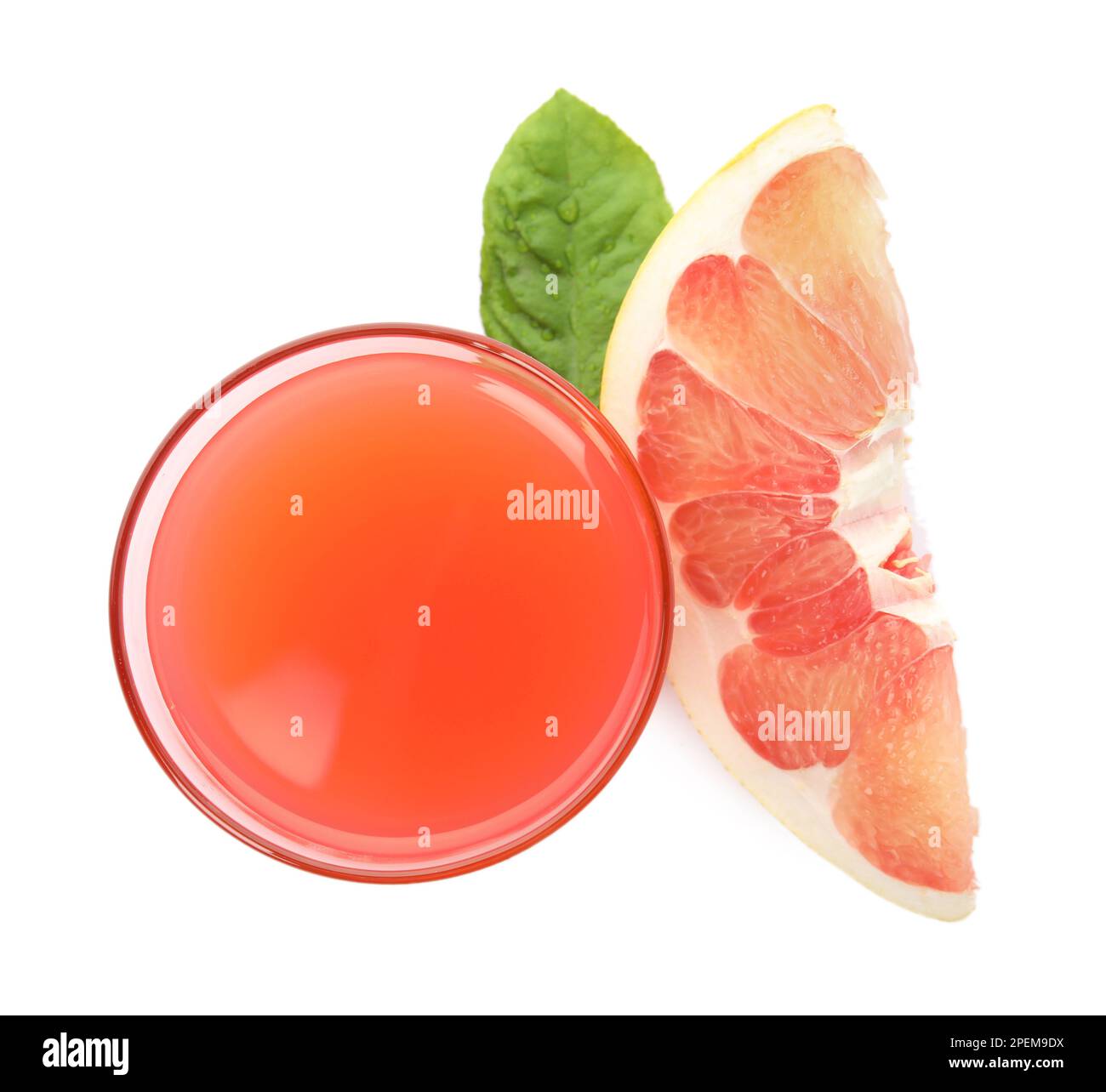 Glass of pink pomelo juice, fruit and green leaf isolated on white, top ...