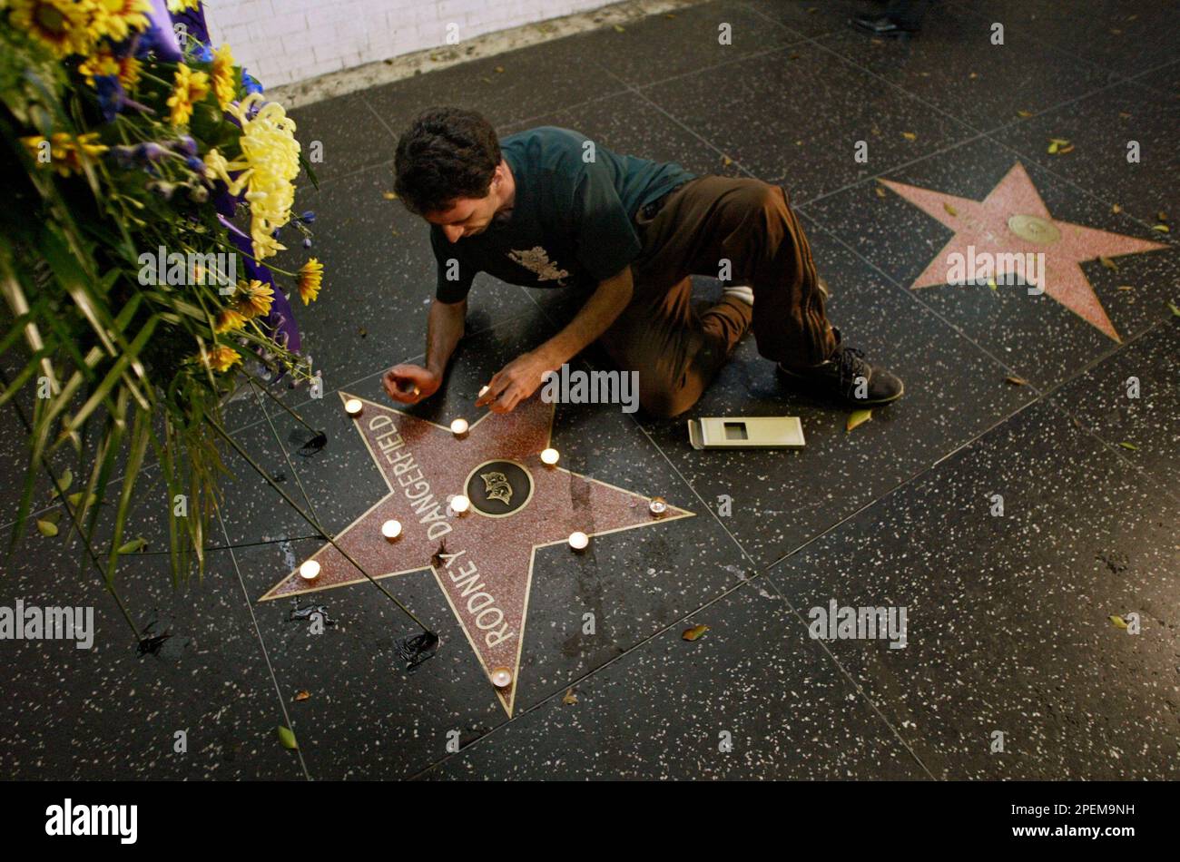 Fan, Michael Smallridge, lights up candles at the Walk of Fame Star of ...