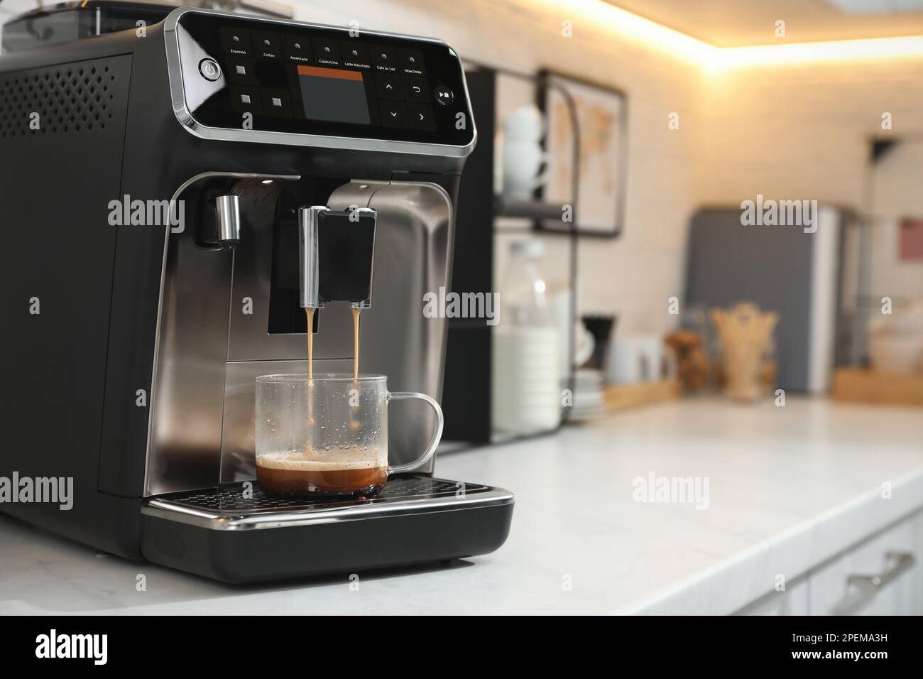 Modern coffee machine making espresso in kitchen, space for text Stock ...