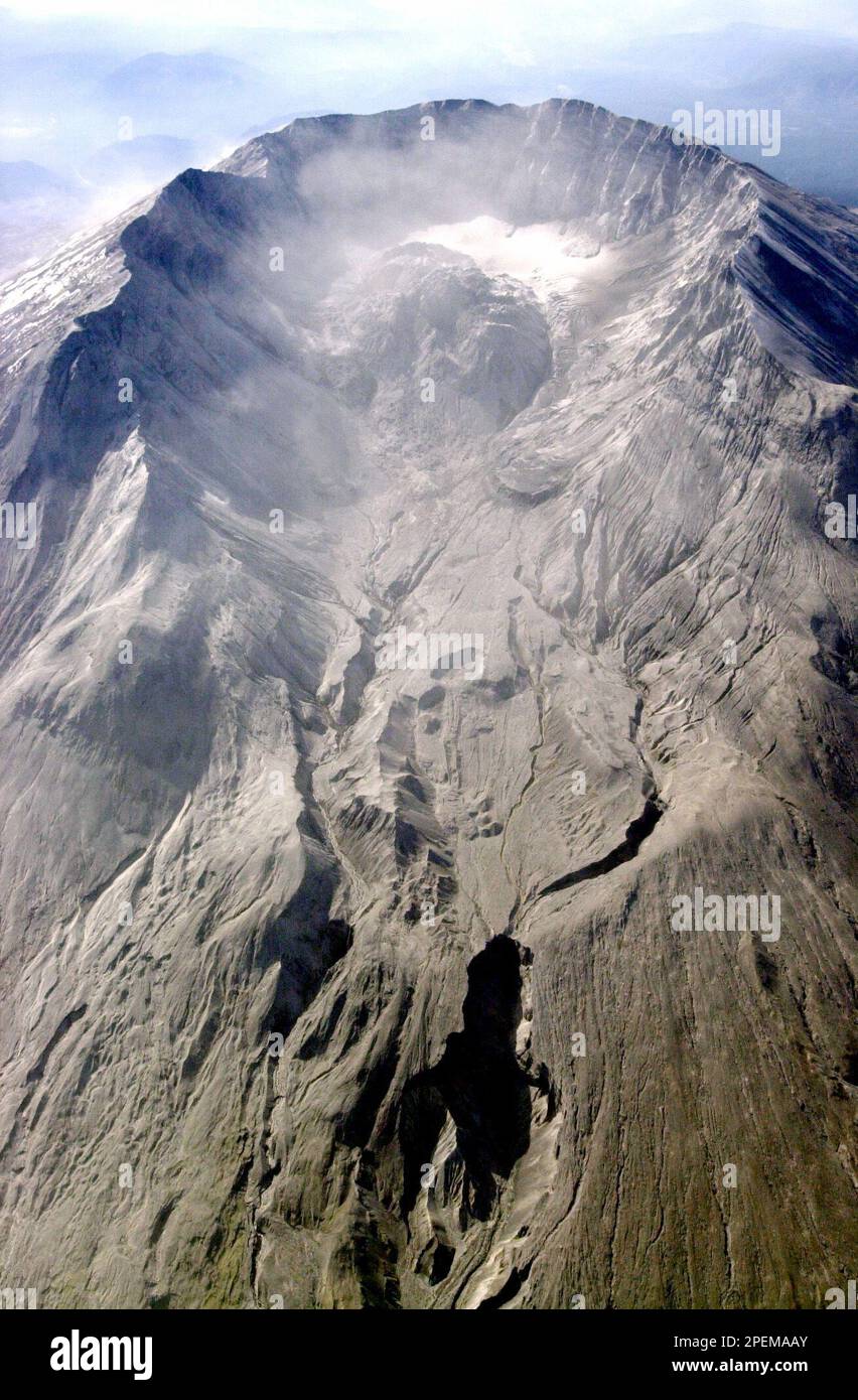 Ash swirls around the crater of Mount St. Helens, Wash., after a steam ...