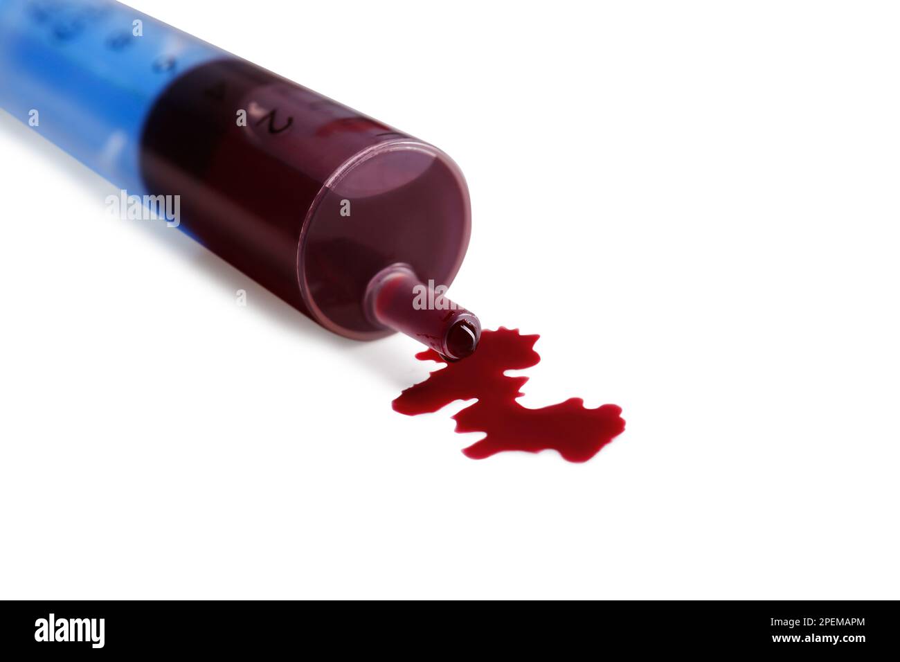Plastic syringe with blood on white background Stock Photo - Alamy