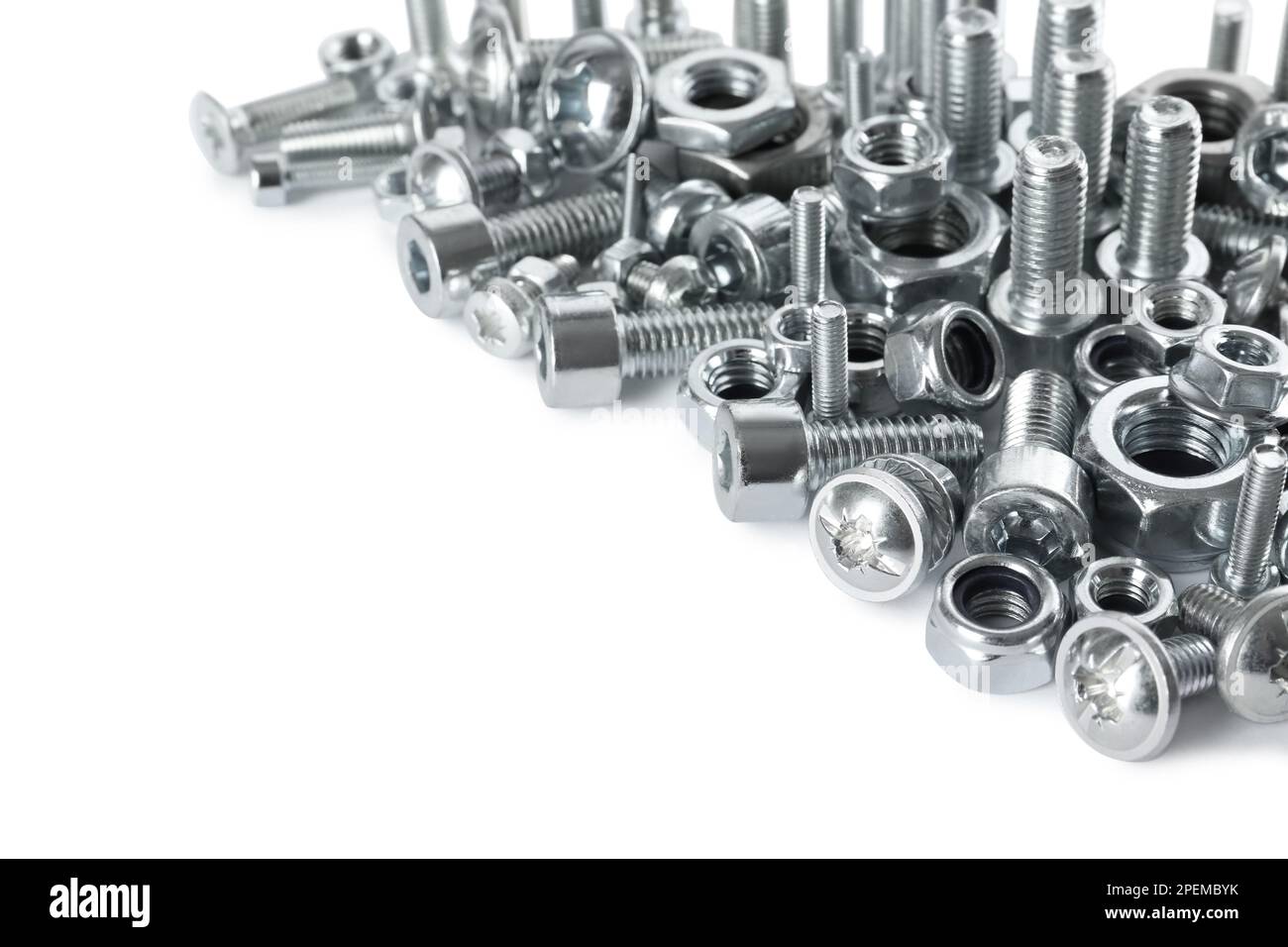 Different metal bolts and nuts on white background Stock Photo - Alamy