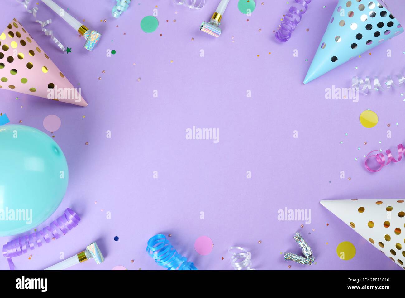 Frame of colorful serpentine streamers and other party accessories on ...