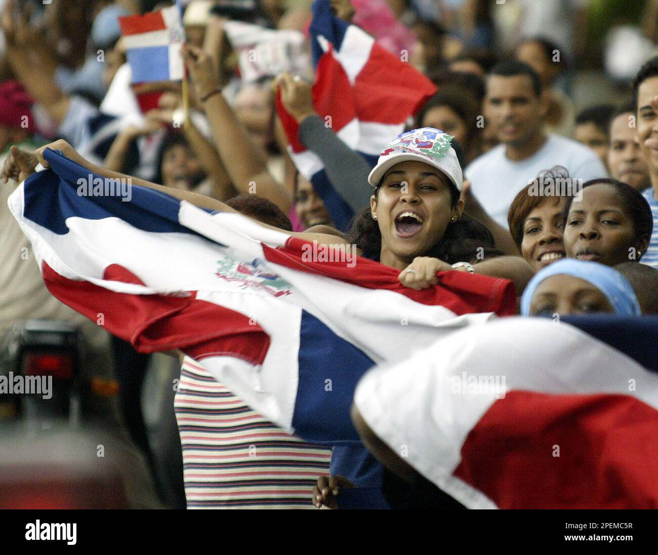 Fans of Felix Sanchez wave Dominican flags on the arrival of the ...