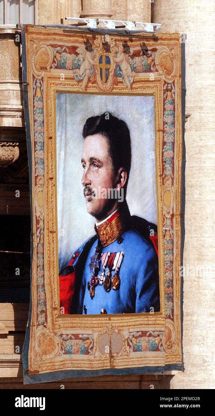 A tapestry hanging outside St. Peter's basilica at the Vatican shows ...