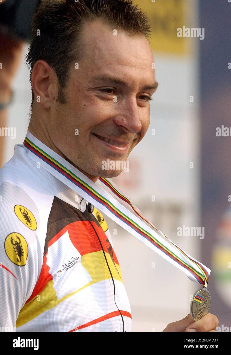 Erik Zabel of Germany shows his silver medal after finishing second in ...