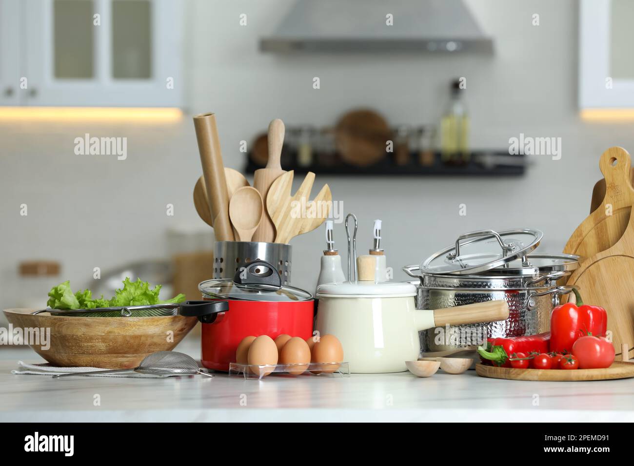 Set of cooking utensils and products on white table in kitchen Stock ...