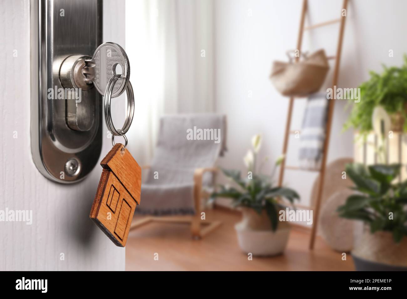 Closeup view of door with key open in room Stock Photo - Alamy