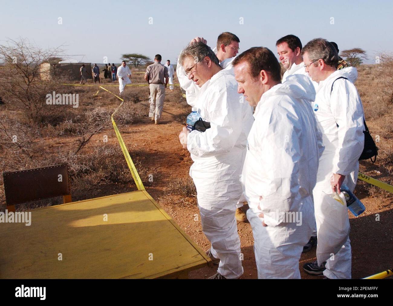 British forensic experts arrive at the site of an alleged rape and ...