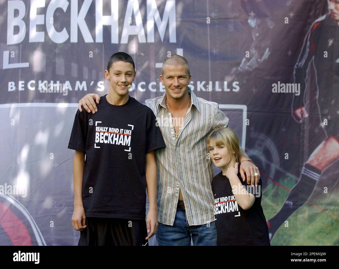 English soccer striker David Beckham poses with Mathew Main, left, and ...
