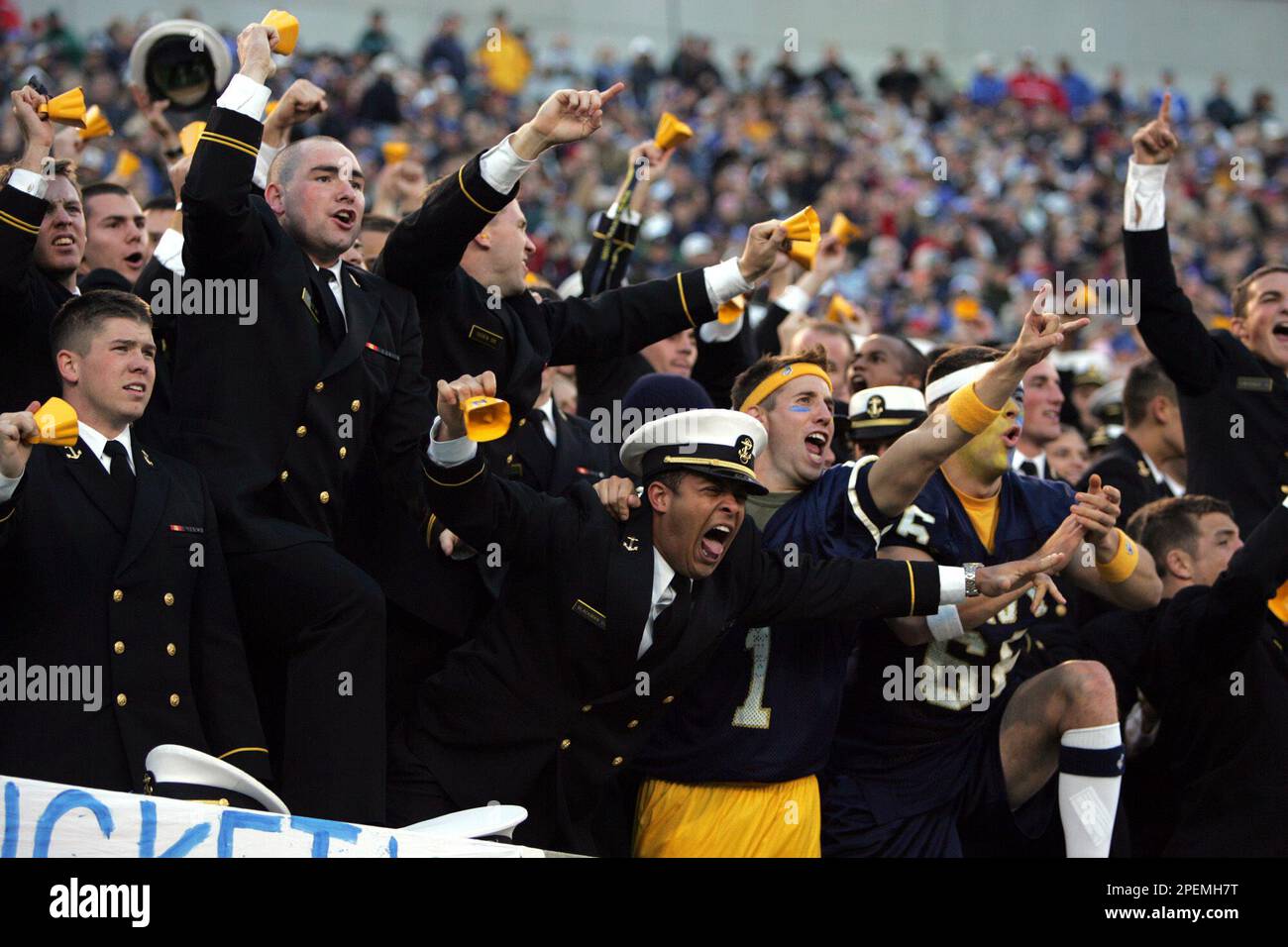 Navy cadets celebrate a sack that forced Air Force to kick a field goal ...