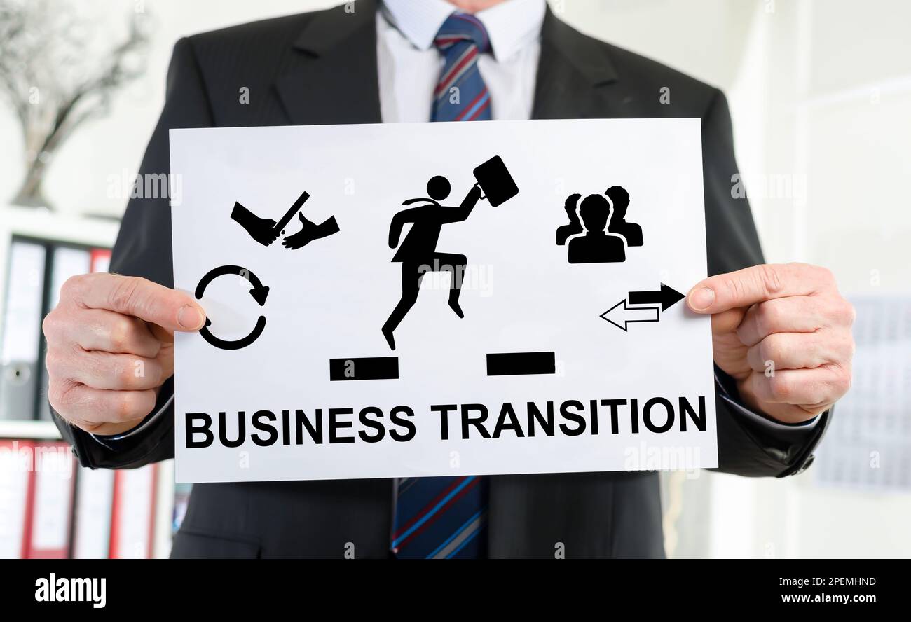 Paper showing business transition concept held by a businessman Stock ...