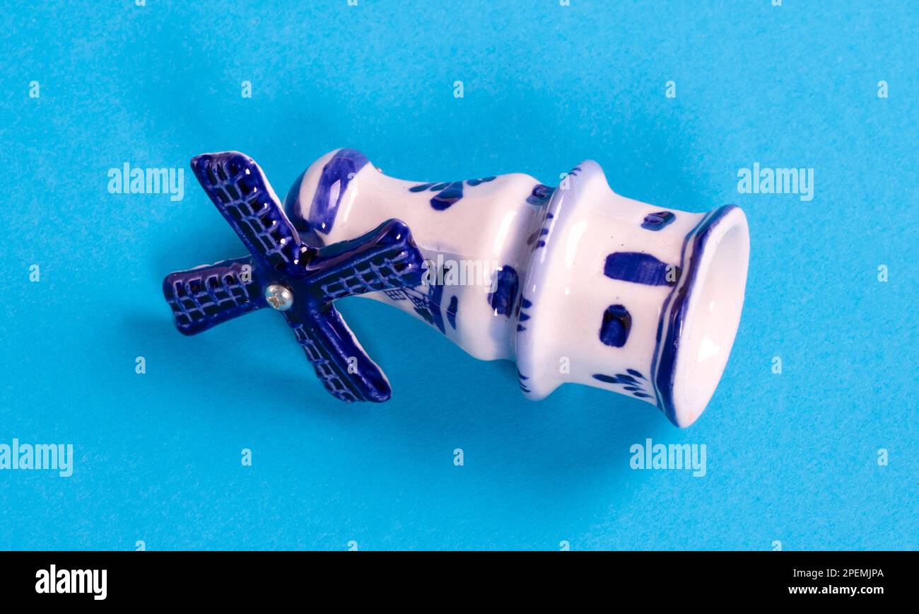Vintage windmill figurine from Holland, isolated on blue Stock Photo ...