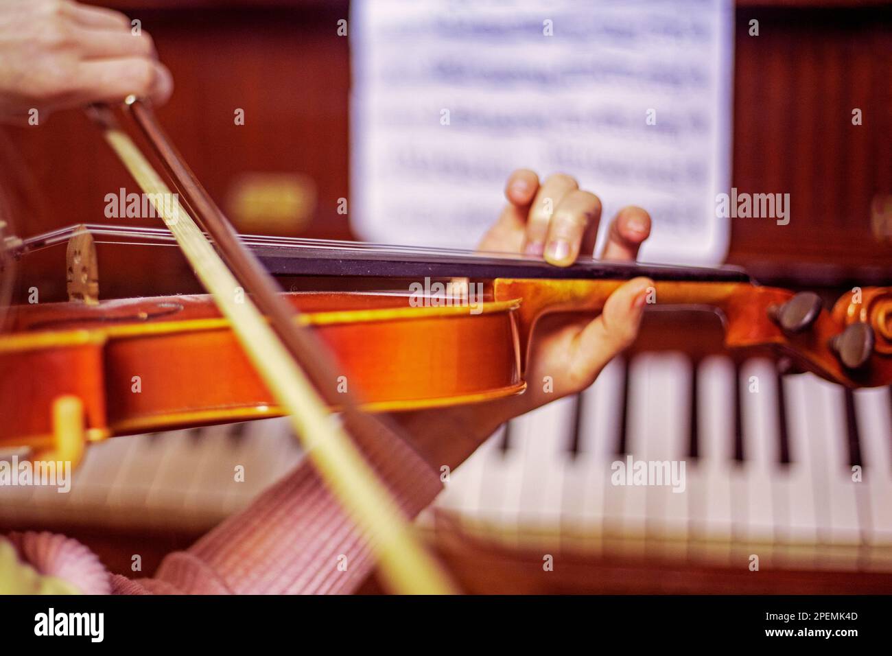 little violinist is learning a piece, setting hands, violin, horizontal ...