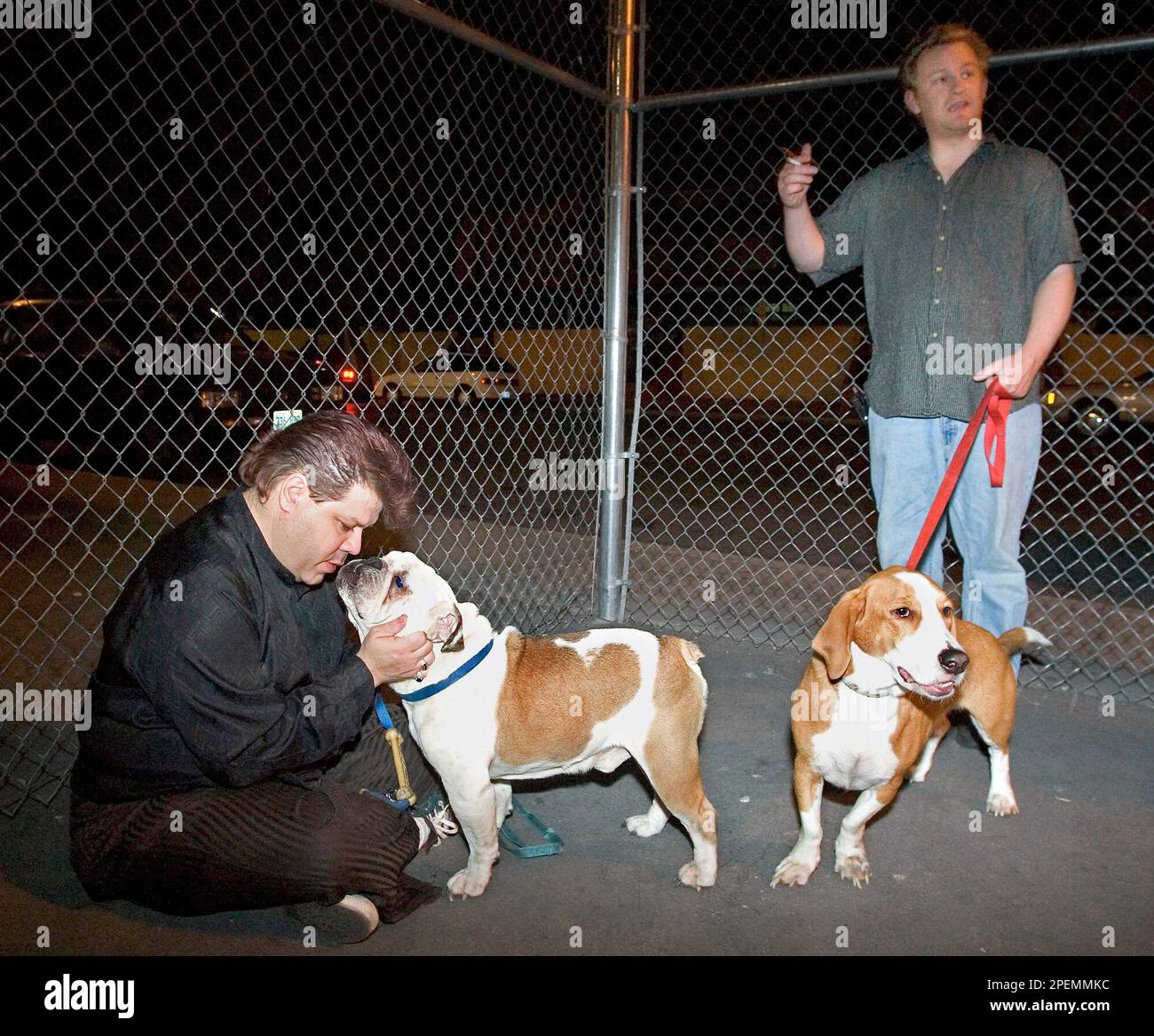 Las Vegas singer Michael Cagle, left, gets a kiss from Dozer as he and ...