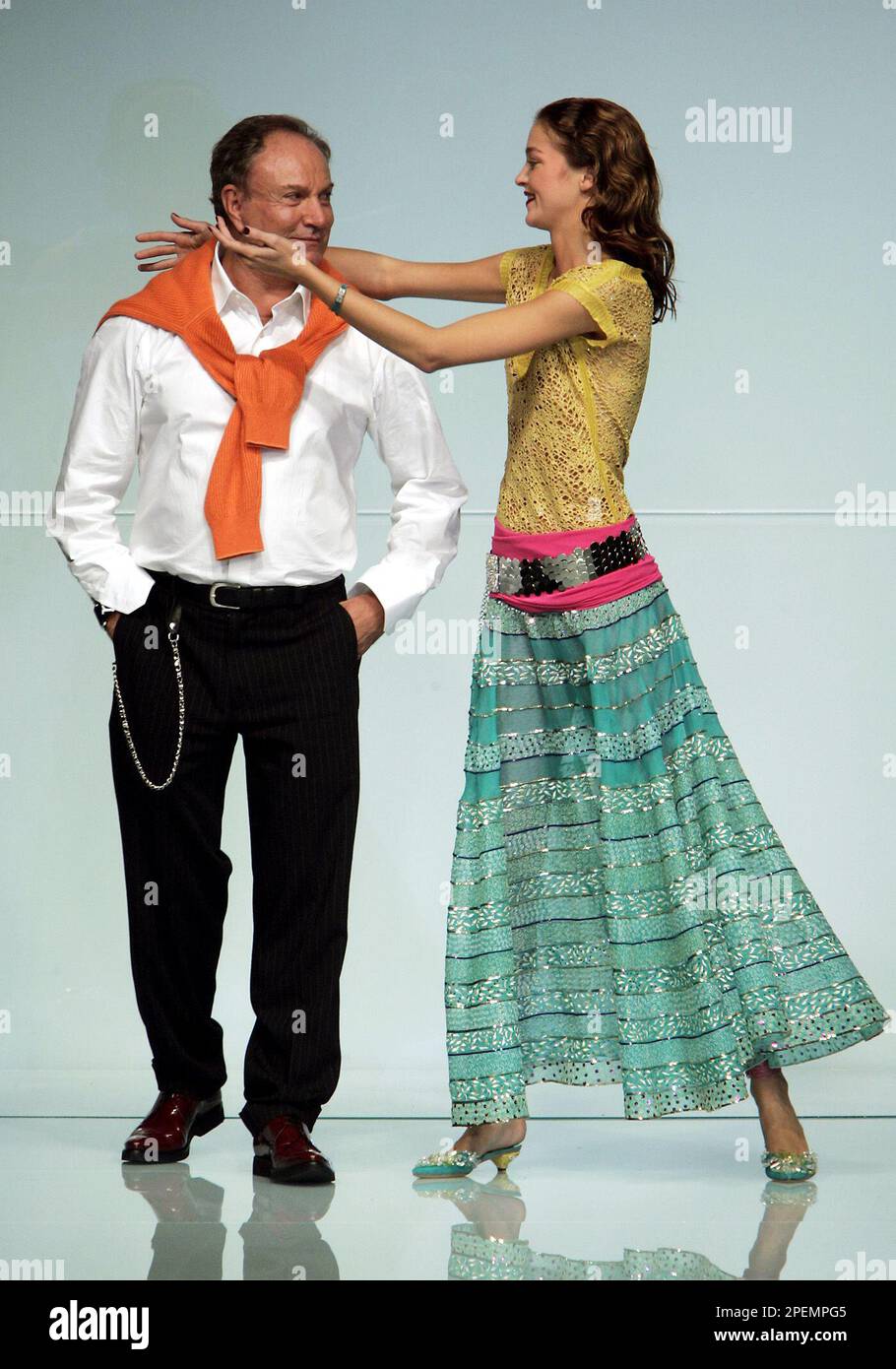 A model embraces Italian fashion designer Rocco Barocco at the end of ...