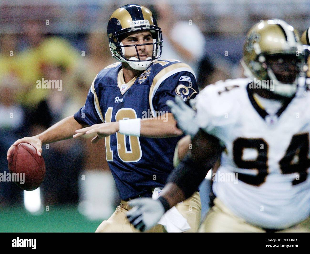 St. Louis Rams quarterback Marc Bulger sets to pass over New Orleans ...
