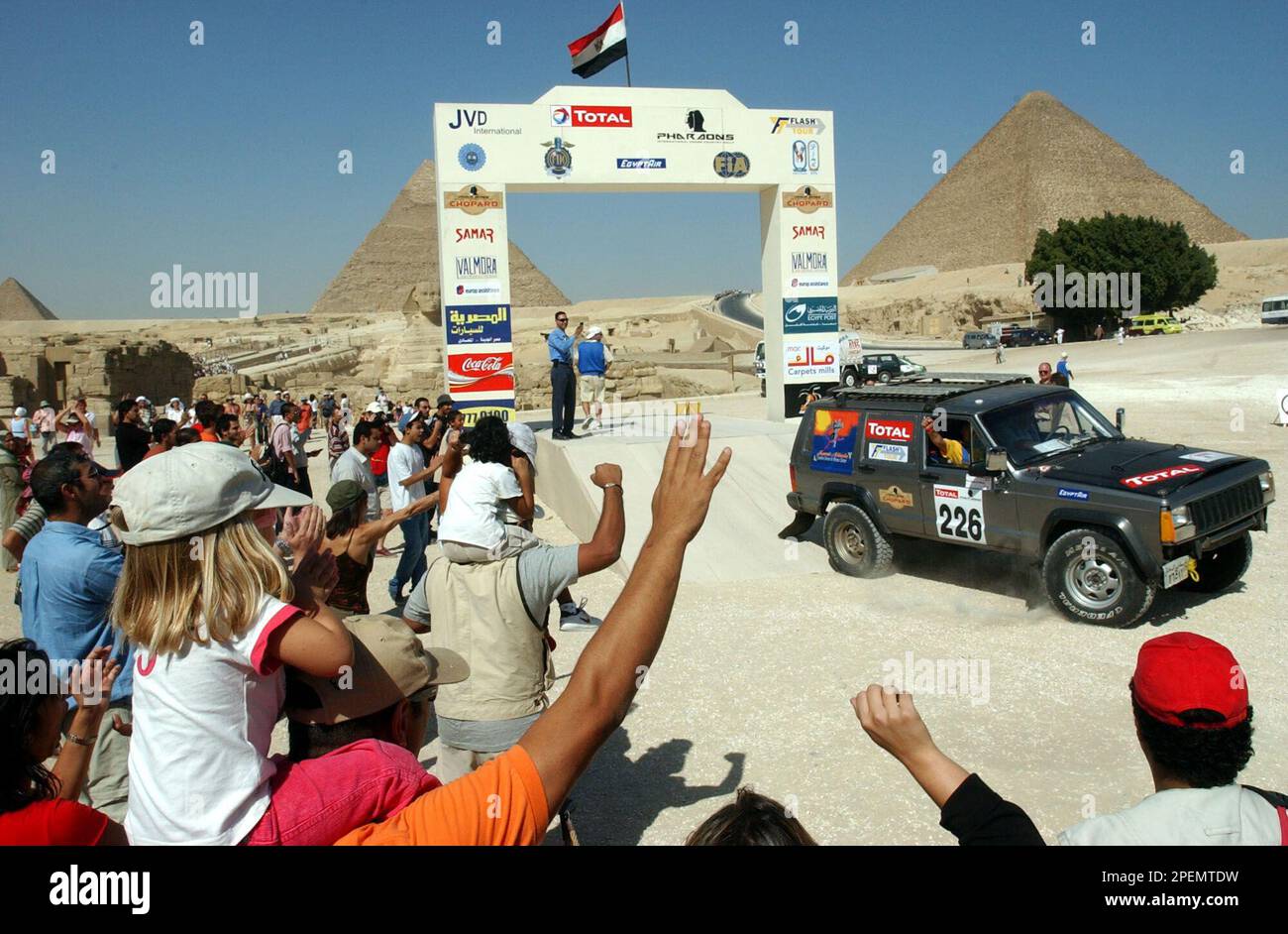 Rally fans greet Egyptian El-Faruqui Azzam as he drives his Jeep ...