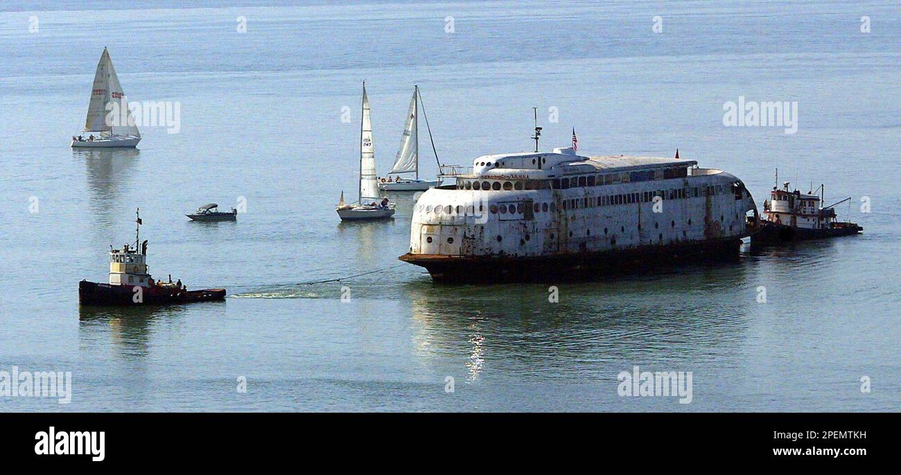 The vintage ferry Kalakala attracts a small flotilla as it is towed ...