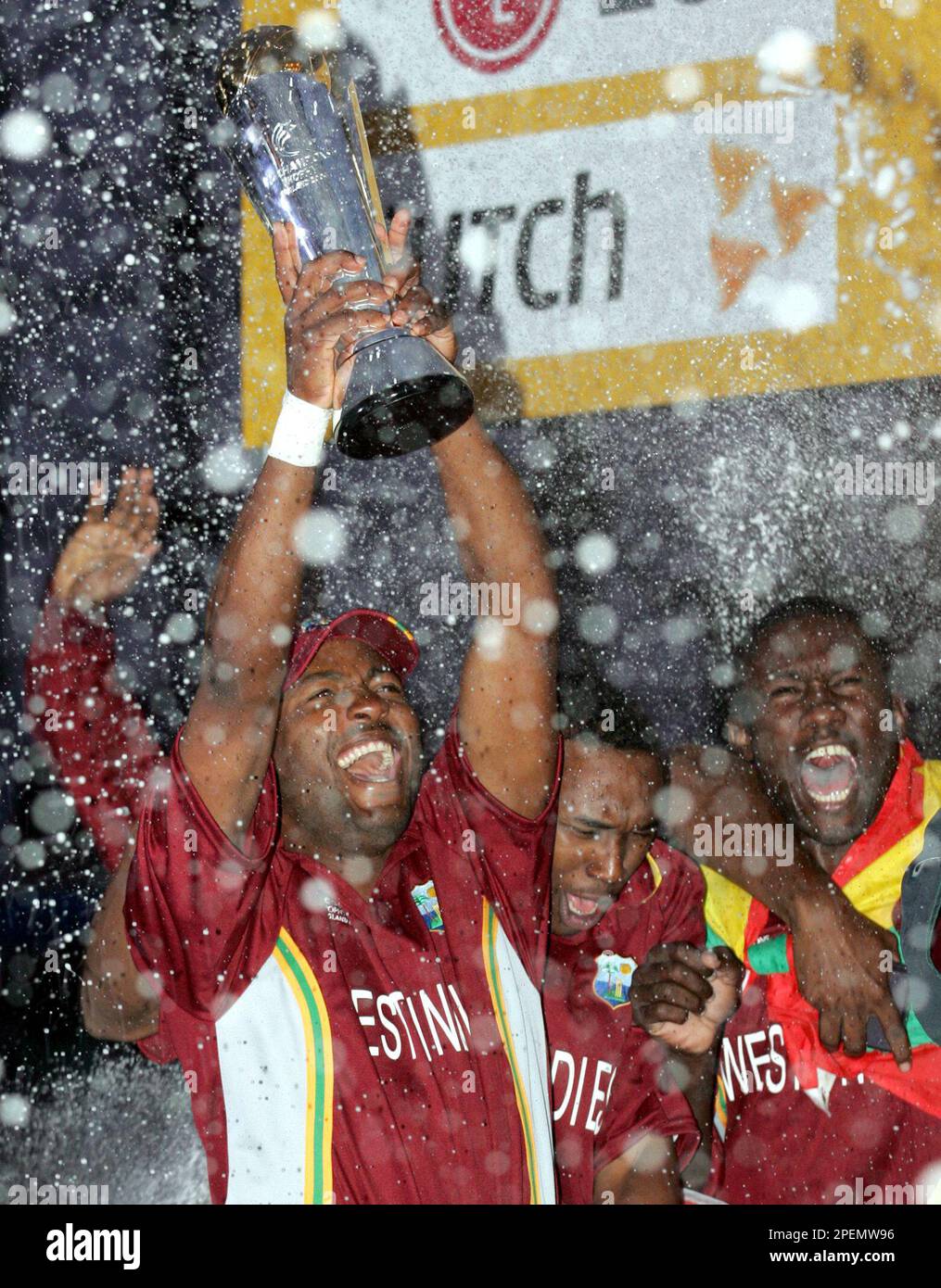 West Indies captain Brian Lara, centre, holds up the ICC Champions ...