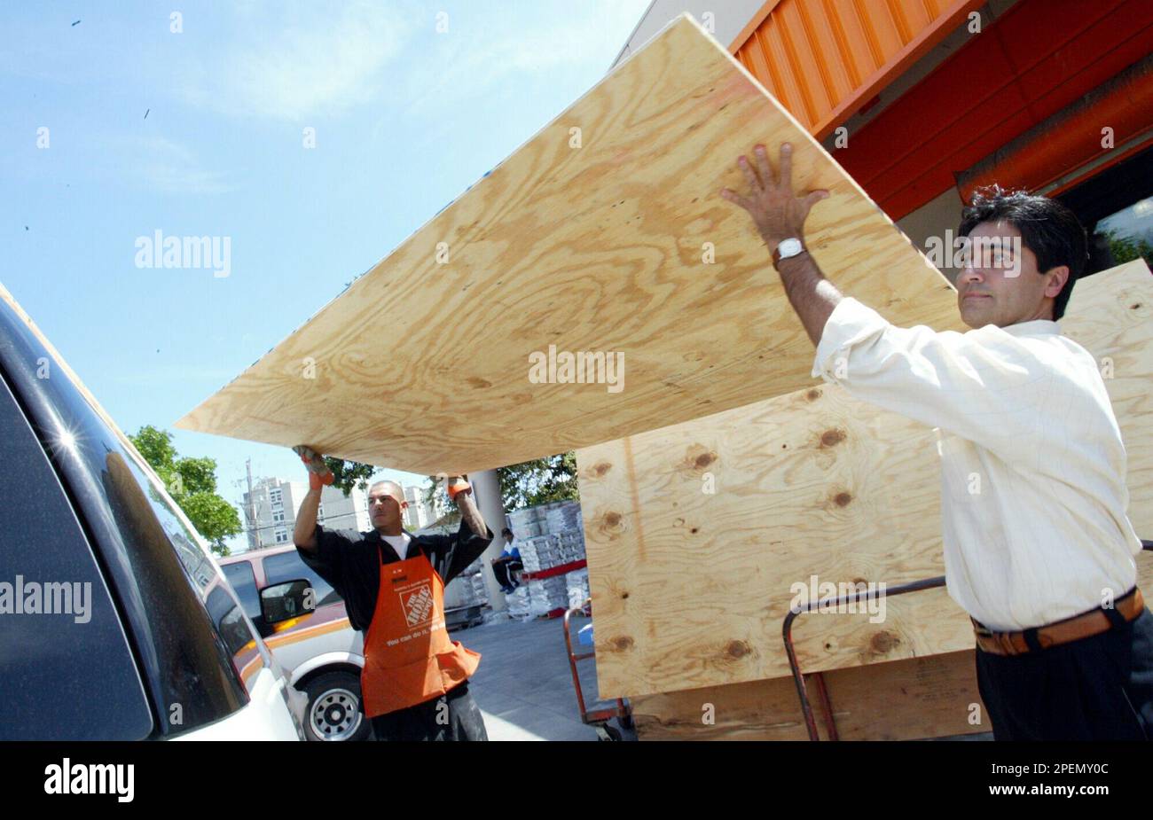 Xavier Rodrigo, right, receives help from Home Depot employee, Marcus ...