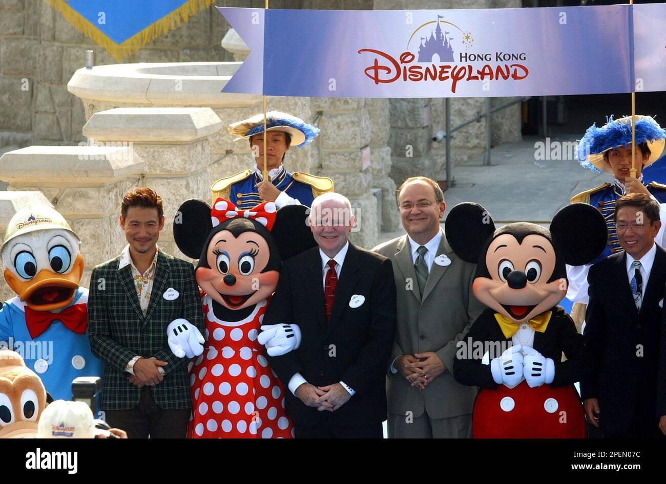 Disney characters pose for photographers with, from left, Hong Kong ...