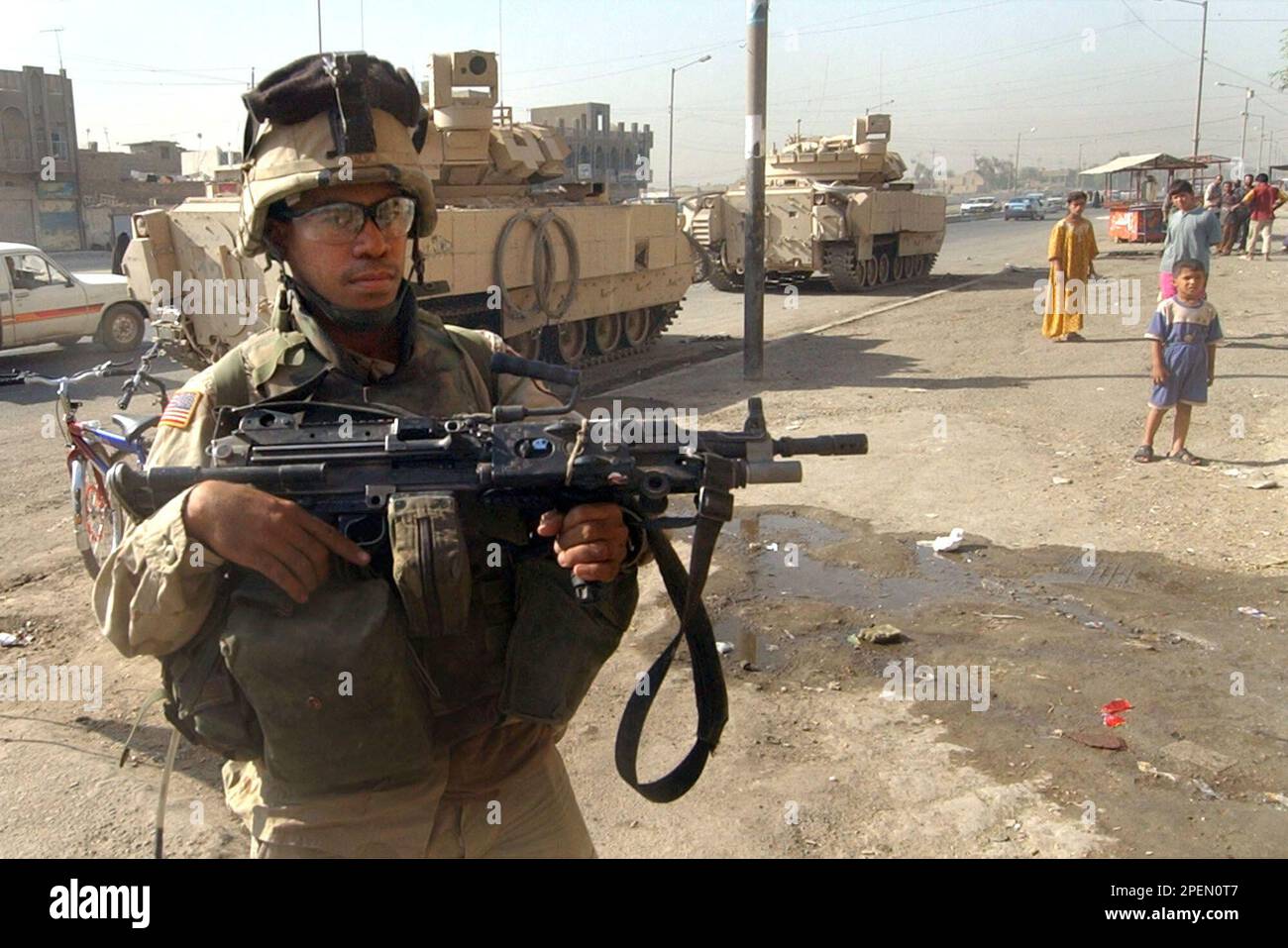 A U.S. Army soldier patrols in the Sadr City section of Baghdad, Iraq ...