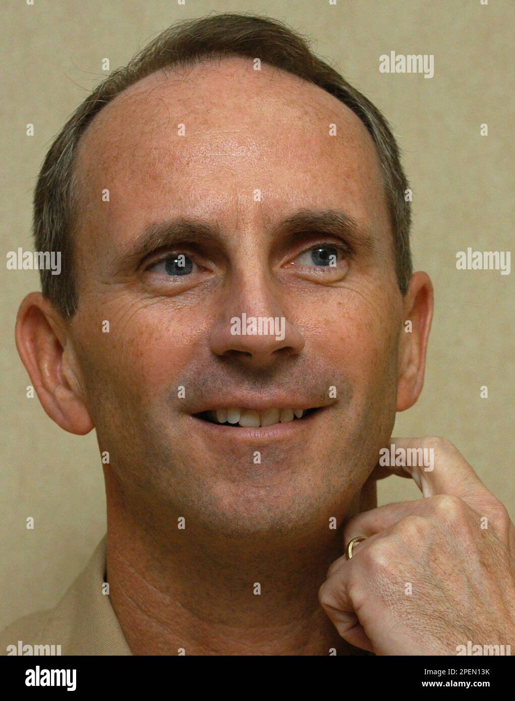 Vice Adm. Jonathan Greenert scratches his neck during an interview with ...