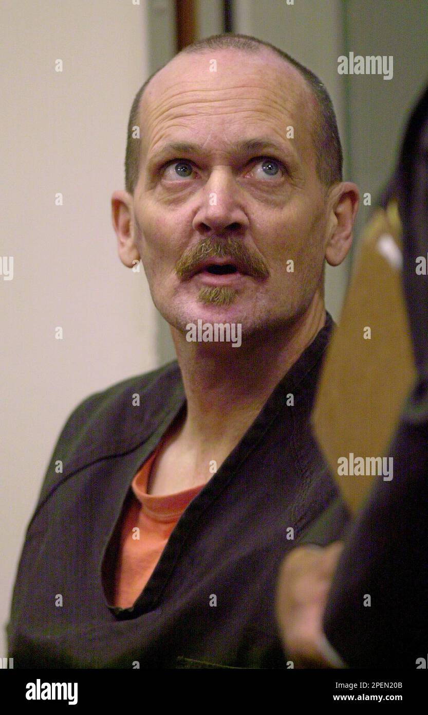 Curtis Dean Anderson talks with his attorney during his plea hearing in ...