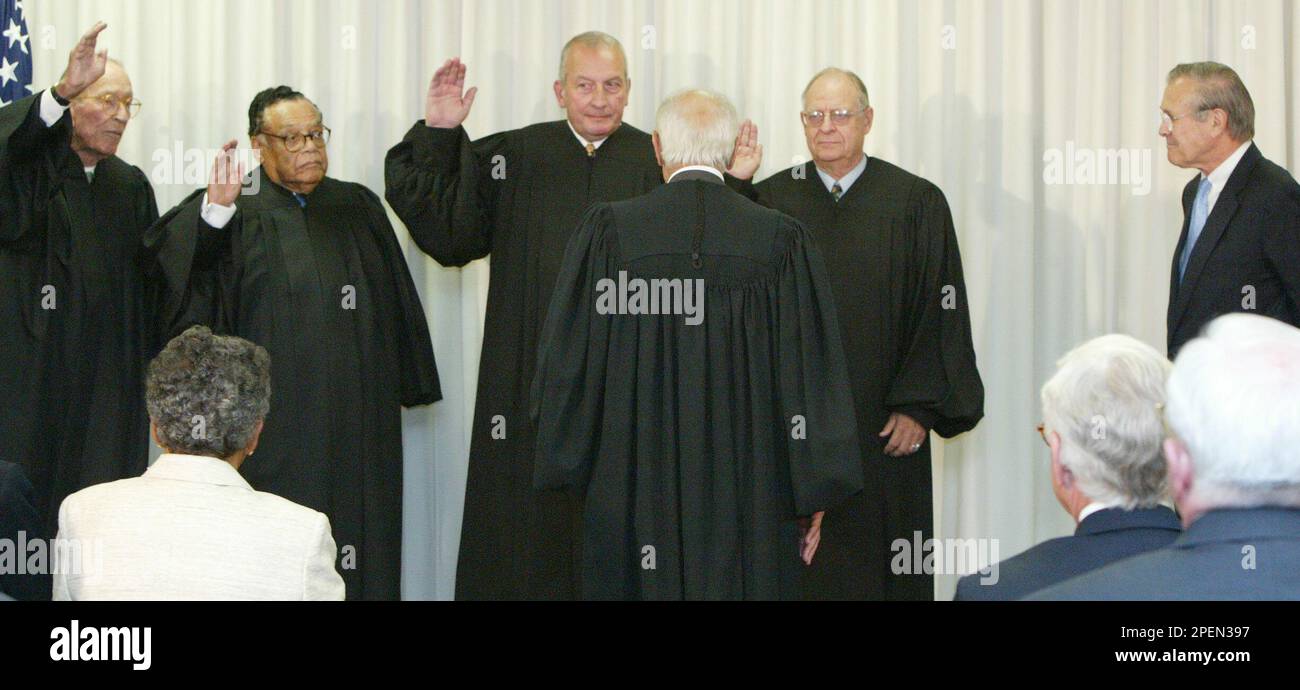 U.S. District Judge Anthony Alaimo, center with back to camera, swears ...