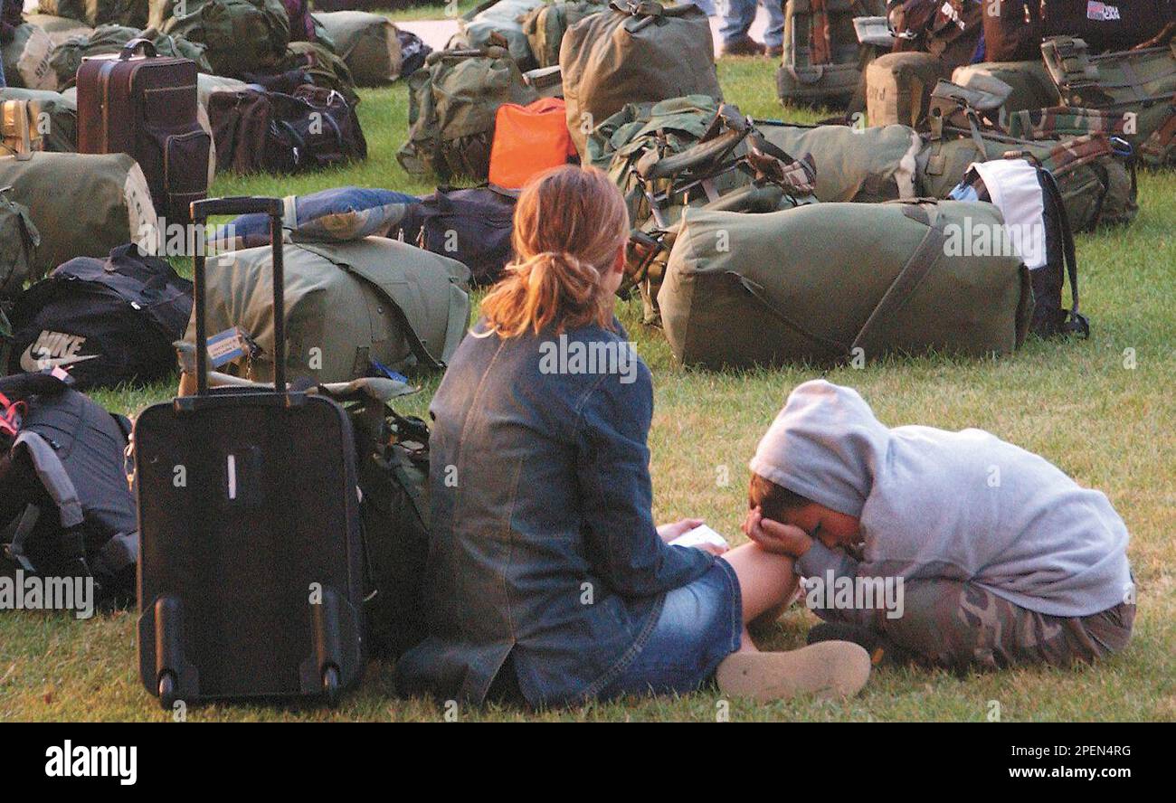 Sherry Nere waits for her husband, Gary, while seated with her son ...
