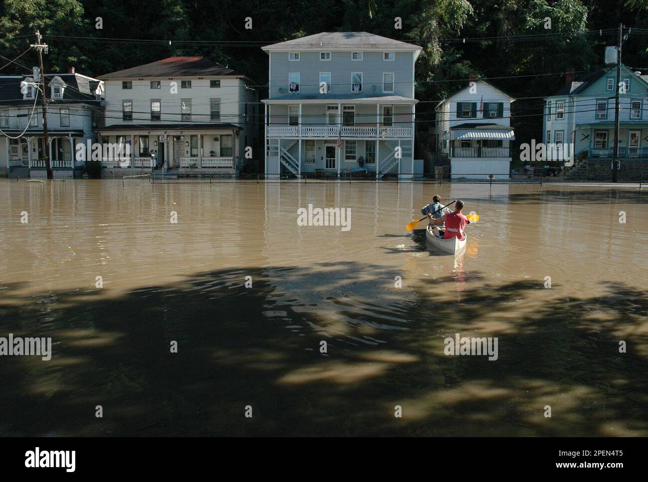 Robert McClellan and Joshua Rebman navigate their canoe through the ...