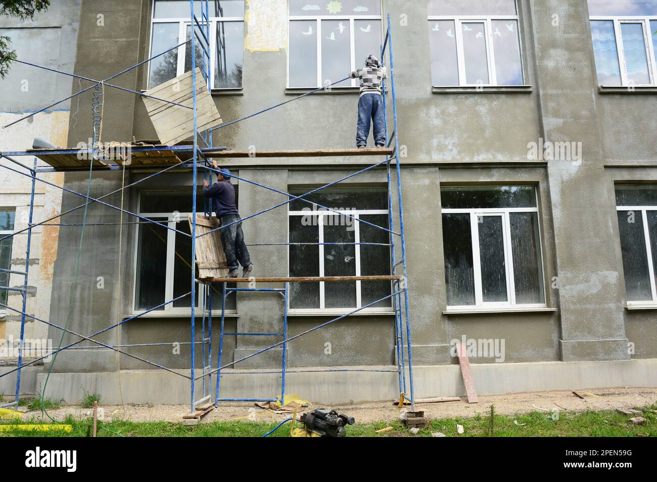 Building contractors are installing, assembling high scaffolding to ...