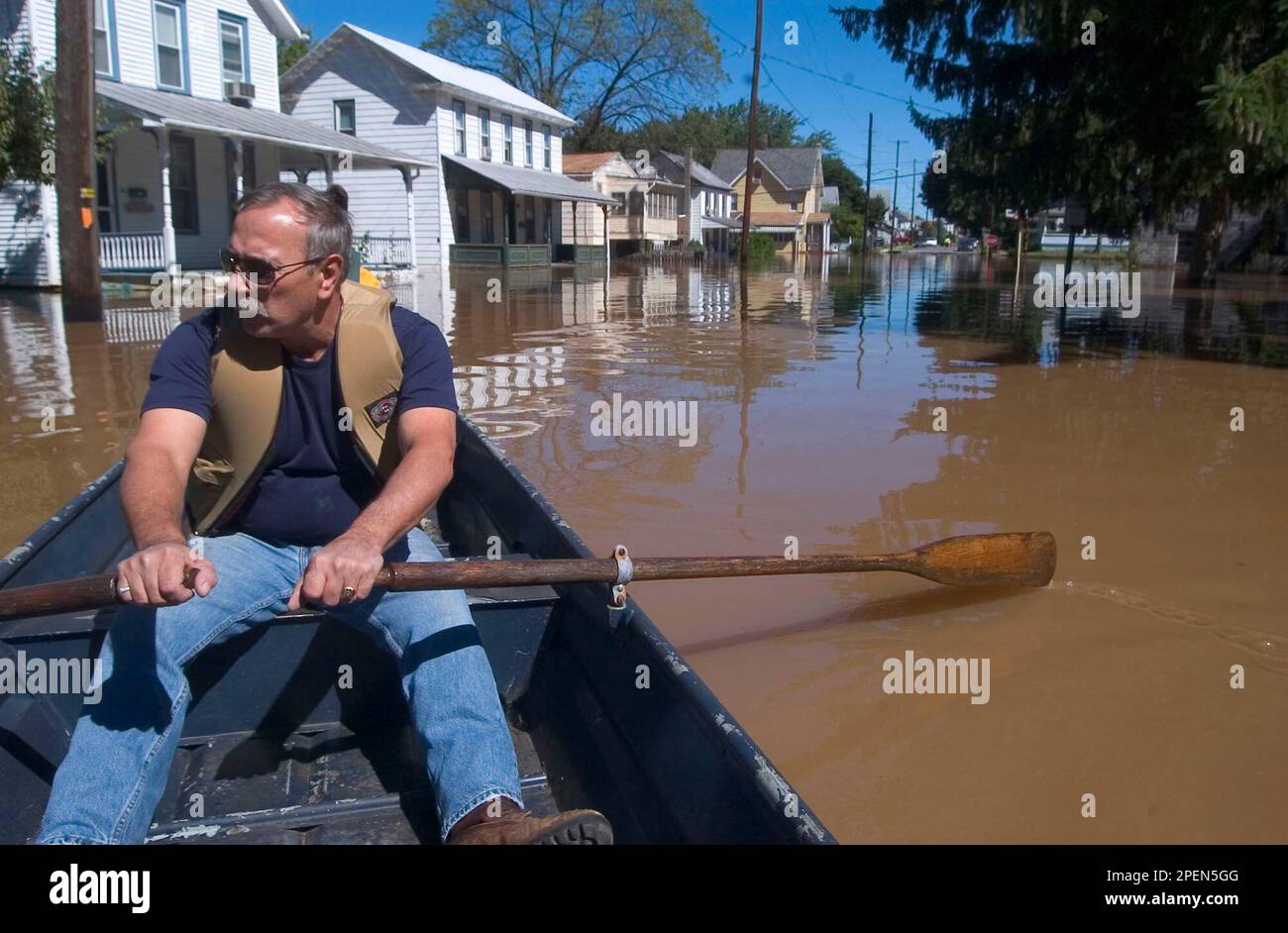 Jim Koziol surveys flood damage on Broad Street in Montgomery, Pa., as ...